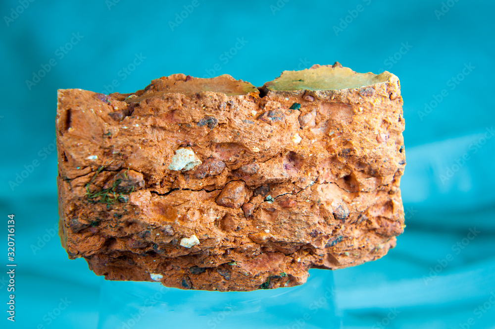 Red brick macro composition close up of a broken red brick internal ...