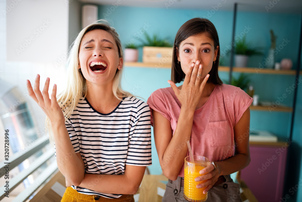 Friendship, happiness and people concept. Young women talking and ...