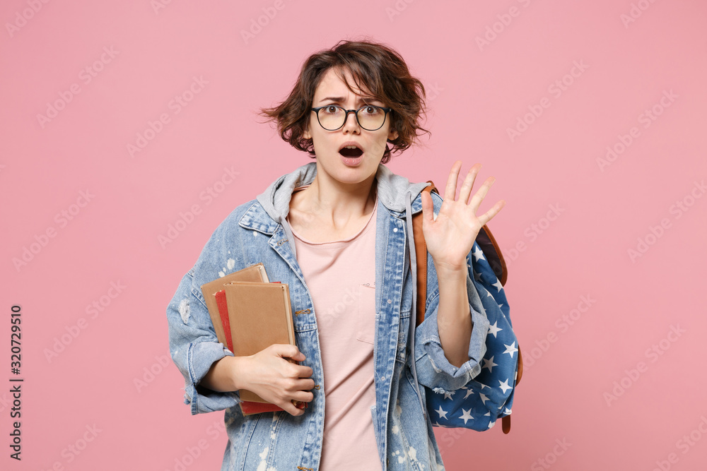 Shocked girl student in denim clothes glasses backpack isolated on ...