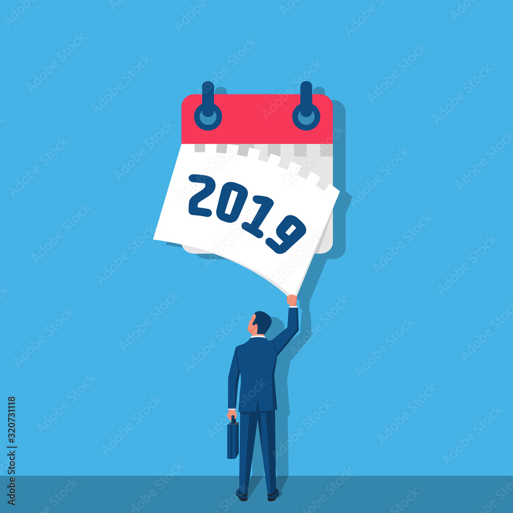 Goodbye 2019. A businessman tears off a calendar sheet of the outgoing ...
