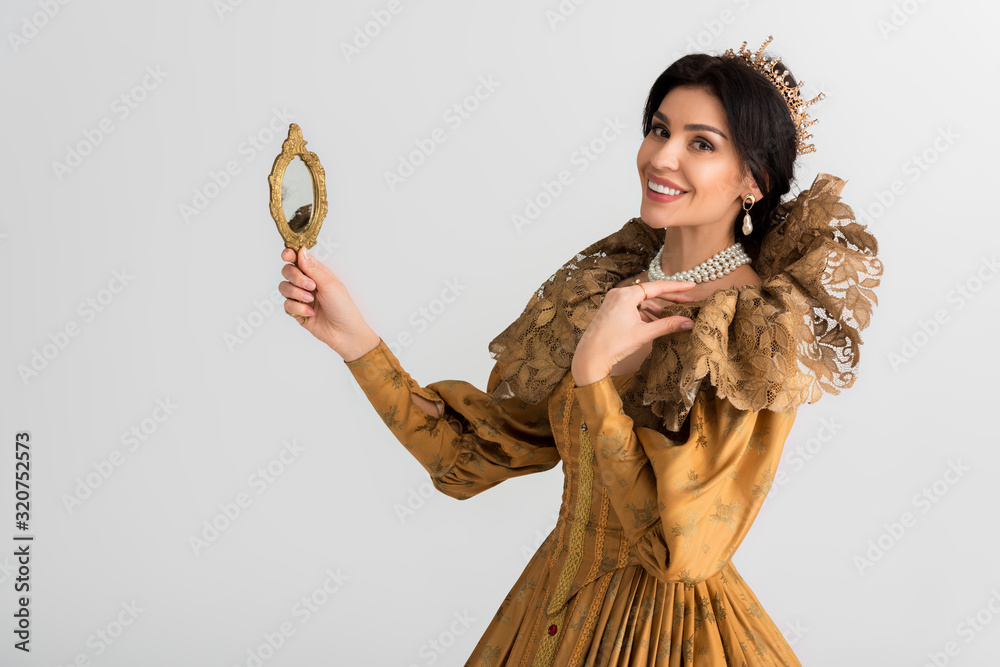 smiling queen with crown holding mirror isolated on grey foto de Stock ...