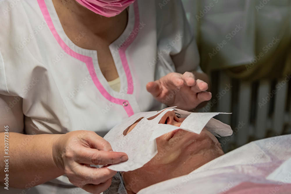 Non-invasive face carboxytherapy in a beauty salon. It is performed for ...