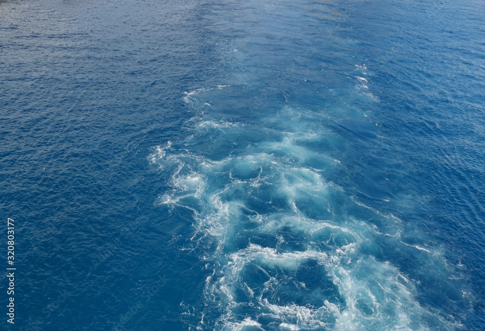 Ripples of water created by a ship's propeller Stock Photo | Adobe Stock