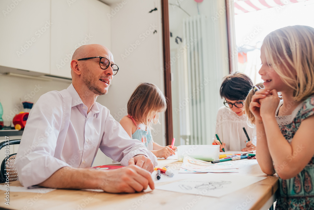 family with three children indoor drawing with coloured pencil Stock ...
