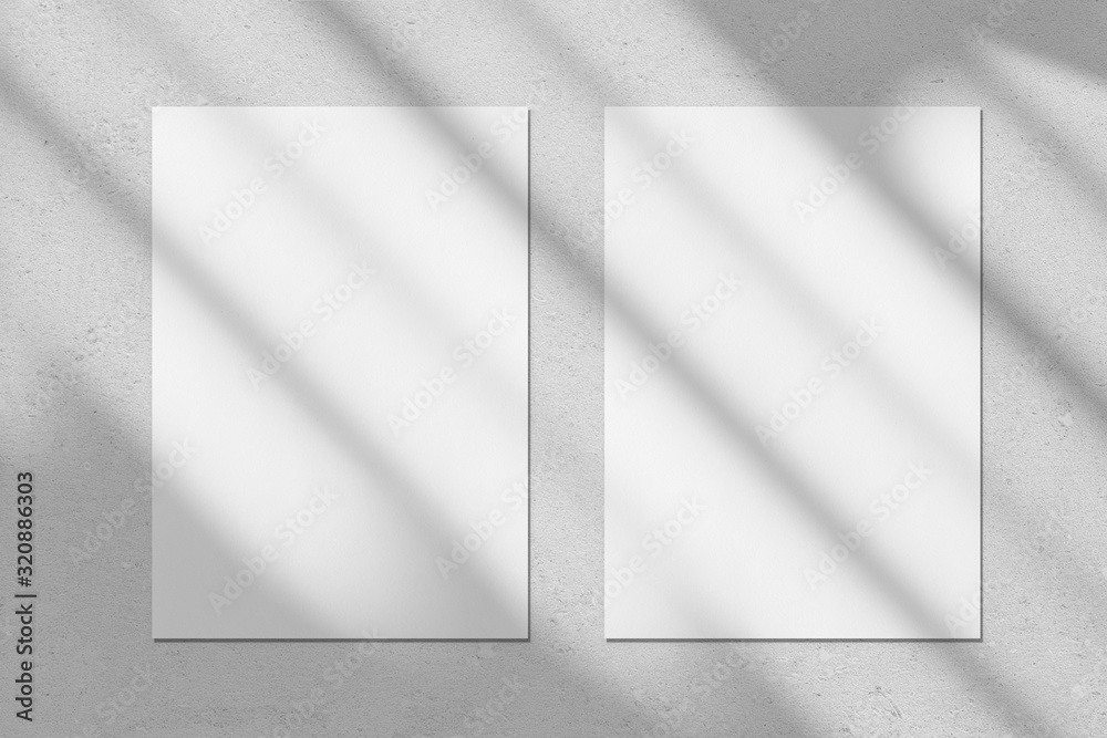 Two empty white vertical rectangle poster or business card mockups with ...