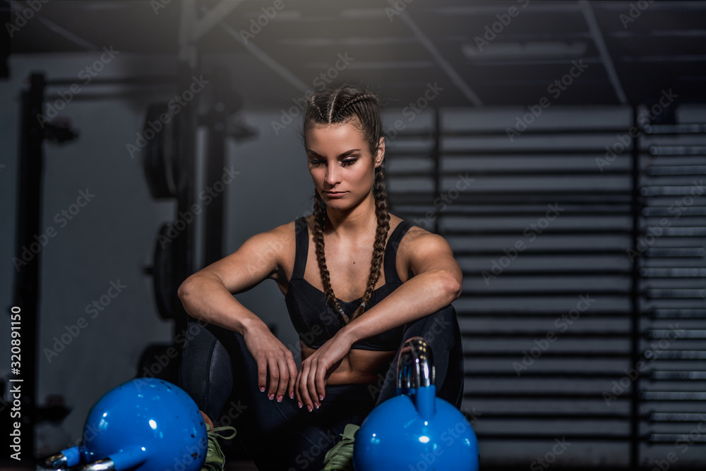 Young Sweaty Strong Muscular Fit Girl With Big Muscles Sitting On The
