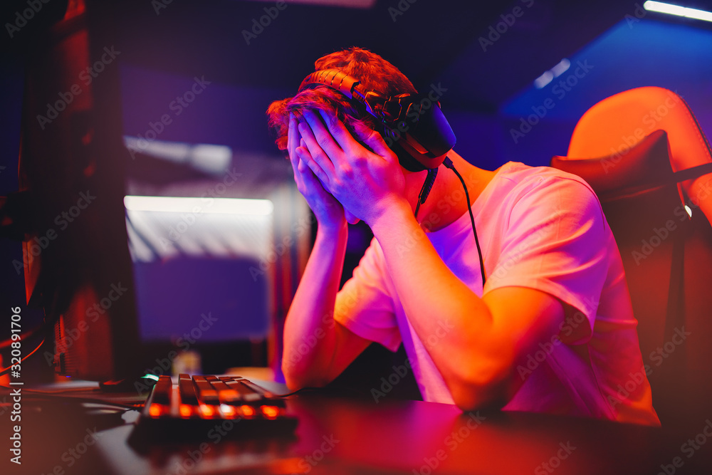 Gamer young man is defeated in online video game, anger and facepalm ...