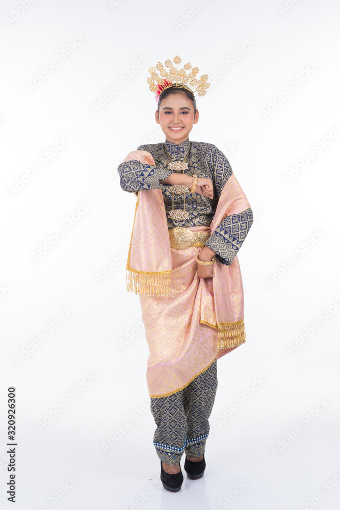 An attractive Malaysian traditional female dancer performing a cultural ...