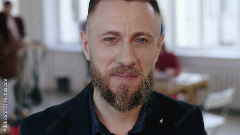 Face of happy middle aged businessman in black suit cheerfully smiling ...