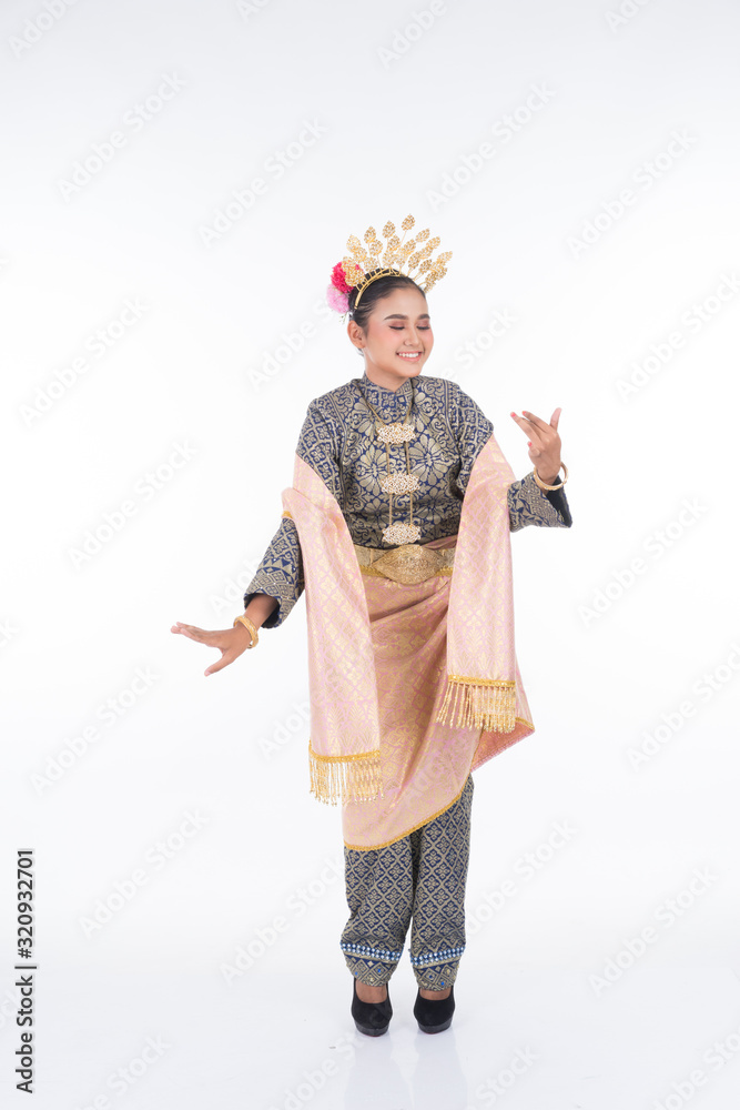 A beautiful Malaysian traditional female dancer performing the dance ...