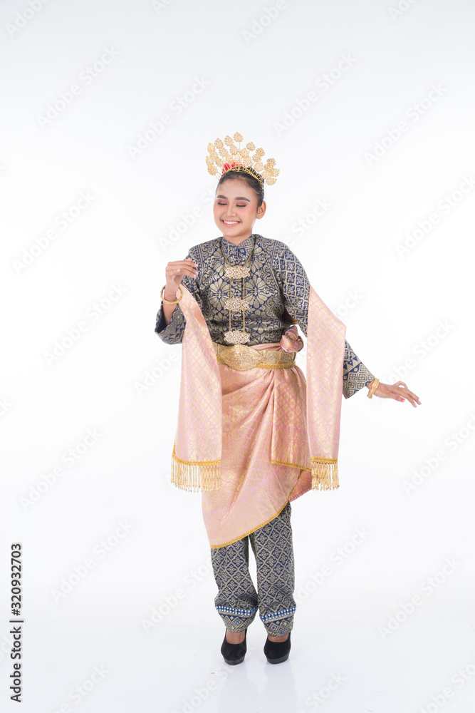 A beautiful Malaysian traditional female dancer performing the dance ...
