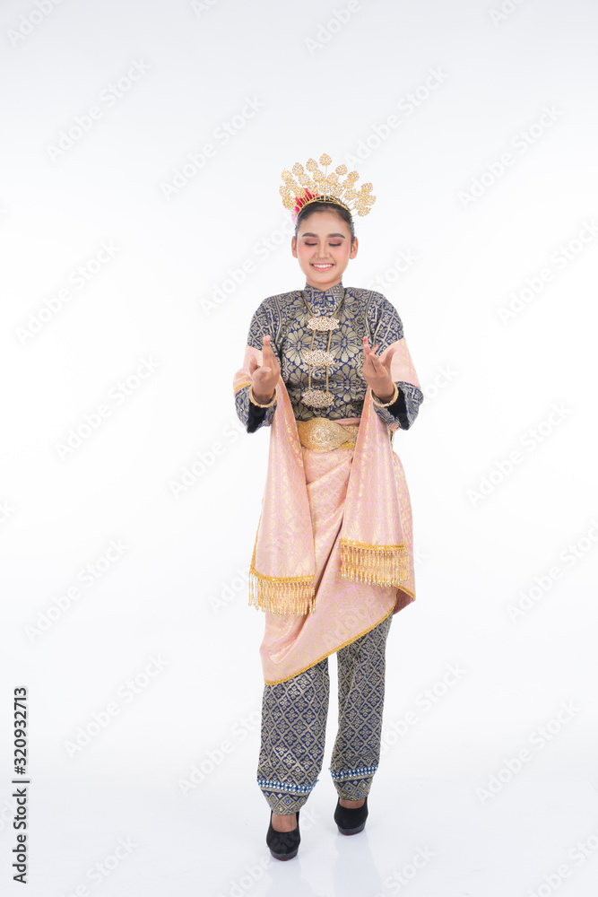 A beautiful Malaysian traditional female dancer performing the dance ...