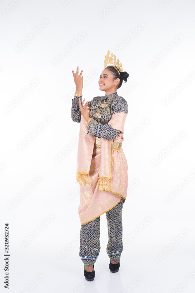 A beautiful Malaysian traditional female dancer performing the dance ...