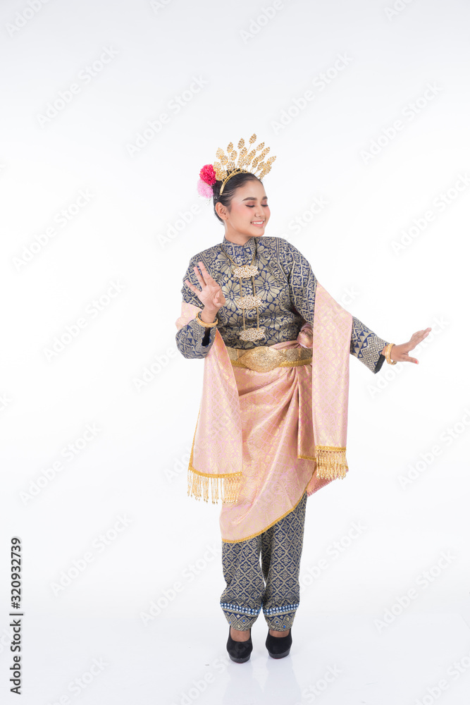A beautiful Malaysian traditional female dancer performing the dance ...