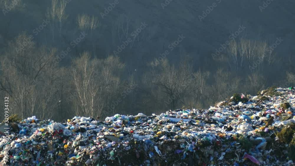 Trash copy space 4K. A huge garbage mountain of unsorted waste ...