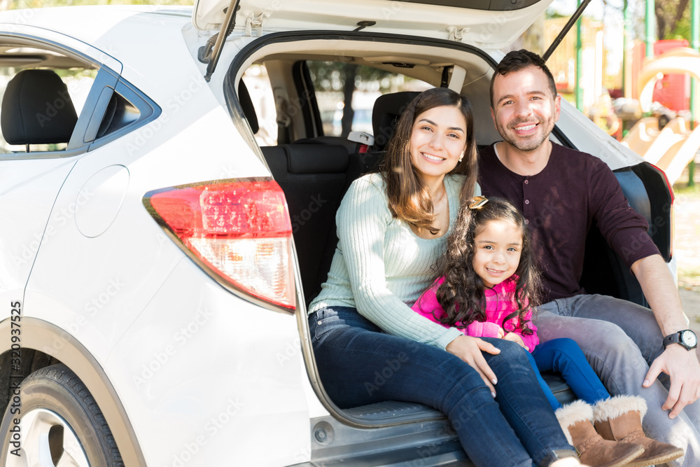Smiling Parents And Daughter In Car Stock Photo | Adobe Stock