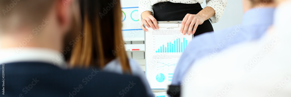 Young beauty teacher woman in class room workgroup seminar board with ...