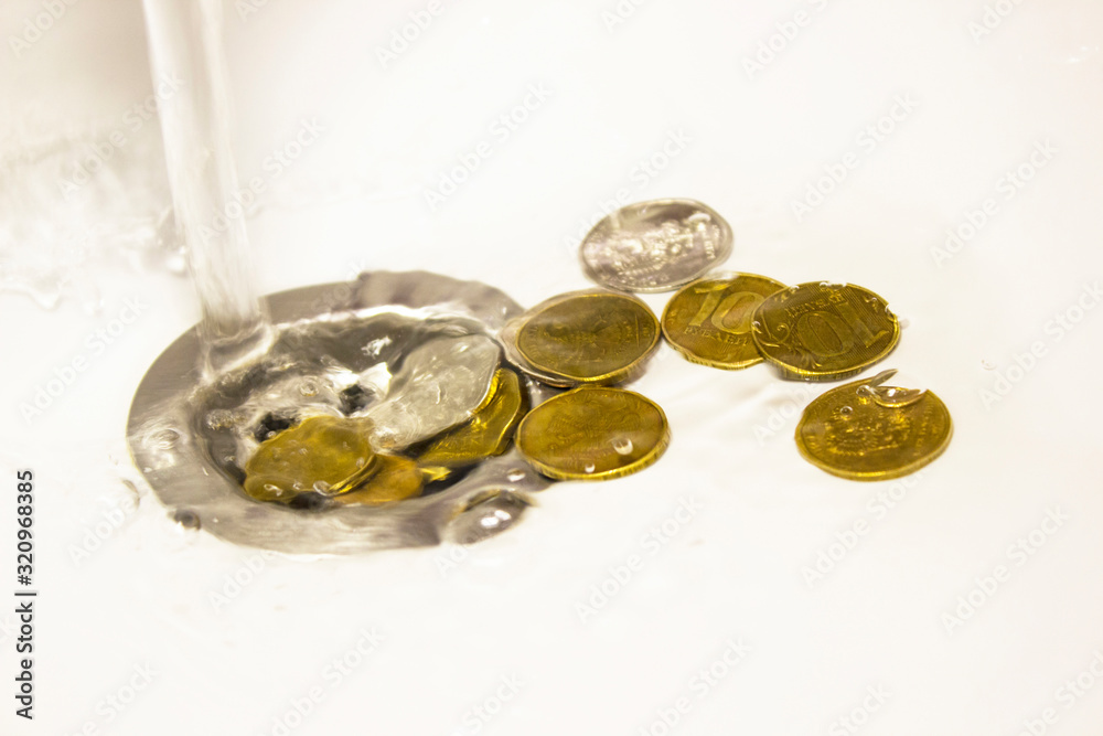 Foto de Money flows like water. Leaking cash. Russian coins flow ...