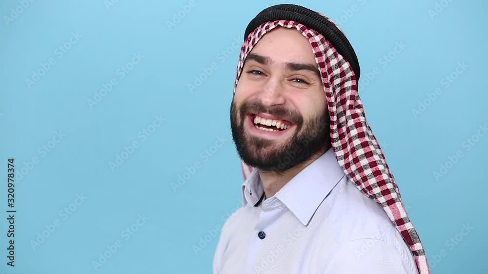 Bearded young arabian muslim man 20s in keffiyeh kafiya ring igal agal ...