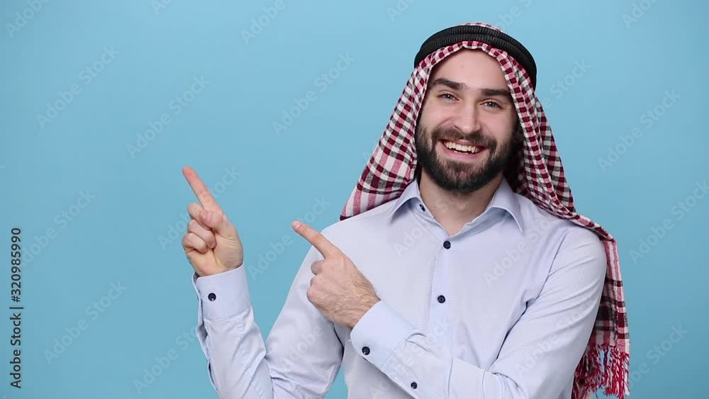 Bearded young arabian muslim man 20s in keffiyeh kafiya ring igal agal ...