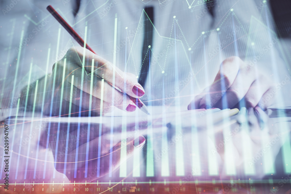 A woman hands writing information about stock market in notepad. Forex ...