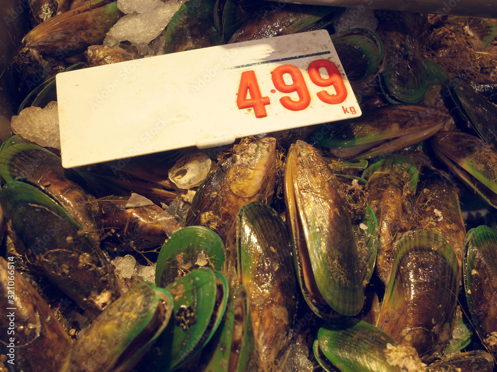 A stack of fresh organic green mussels at a wet market fresh seafood ...