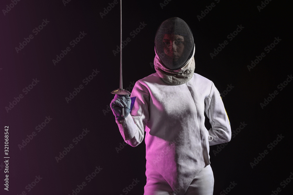 Young female fencer on dark background Stock Photo | Adobe Stock