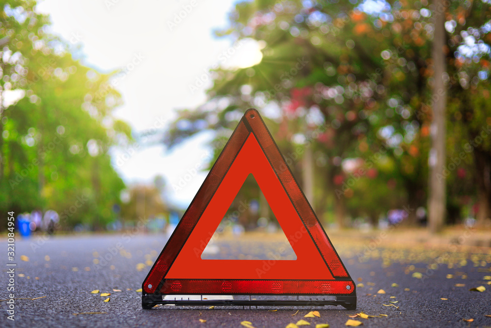 Red triangle, red emergency stop sign, red emergency symbol on road ...