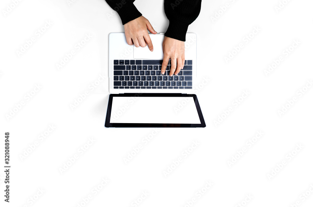 Person using a laptop computer on a solid color background Stock Photo ...