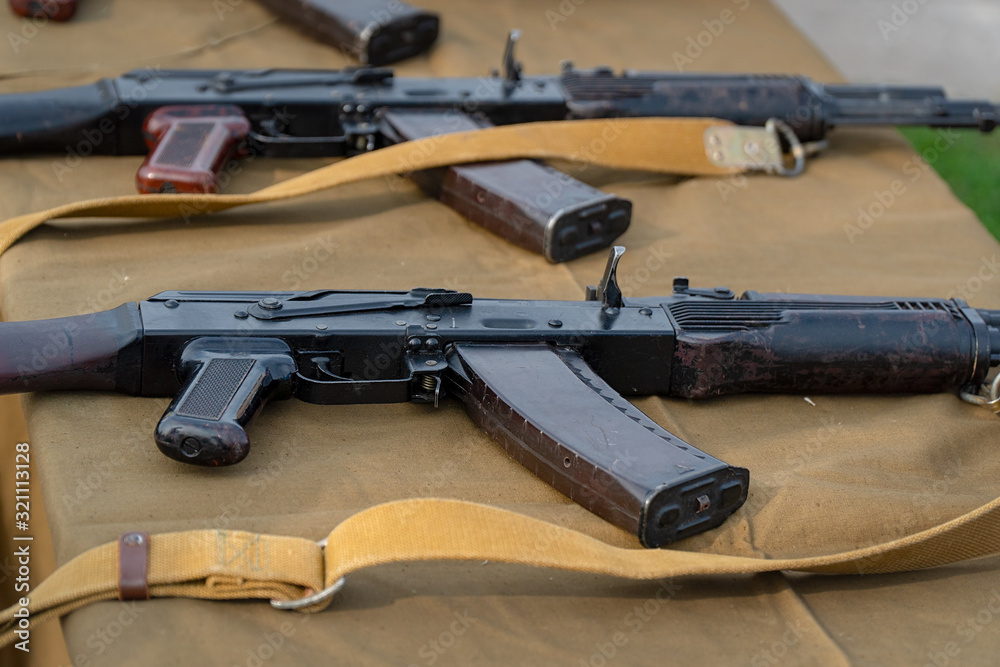 Kalashnikov assault rifles on the table Stock Photo | Adobe Stock