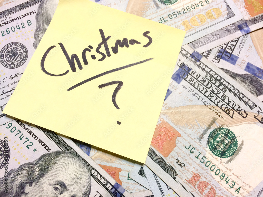 American cash money and yellow post it note with text Christmas with ...