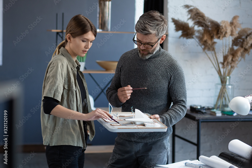 3d architects team working in office with building 3d model. Architects ...