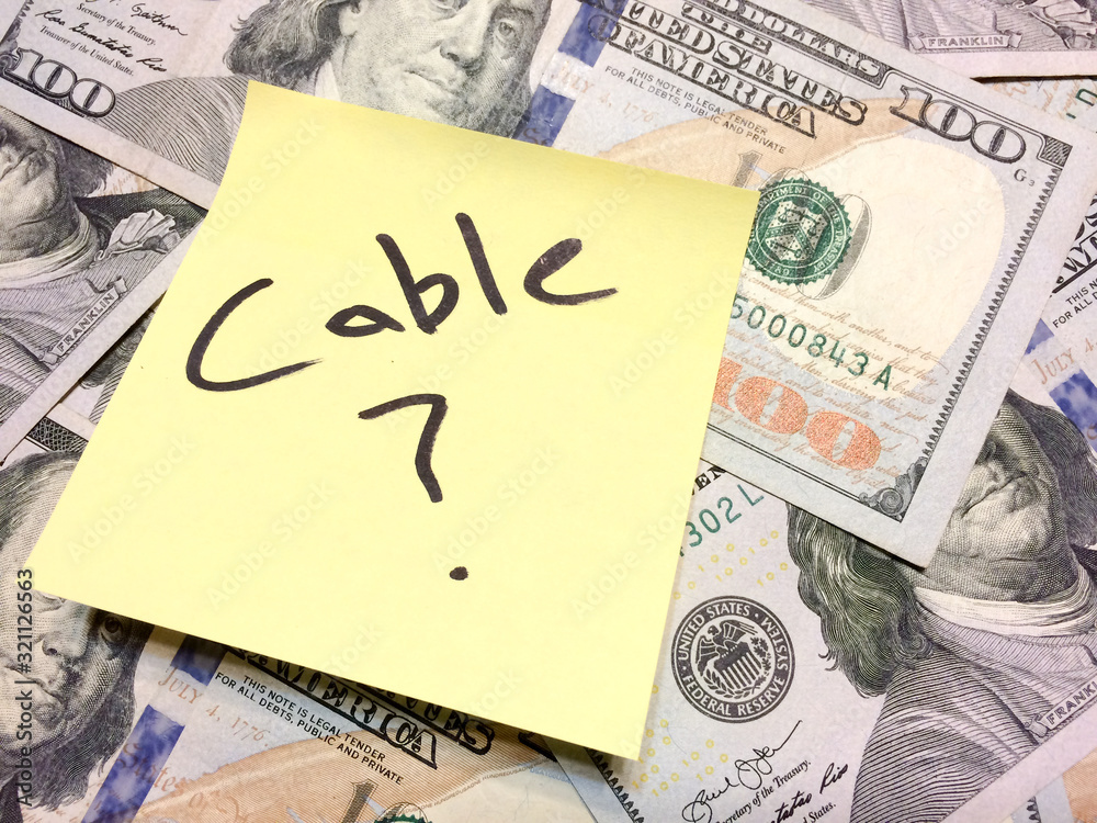 American cash money and yellow paper note with text Cable with question ...