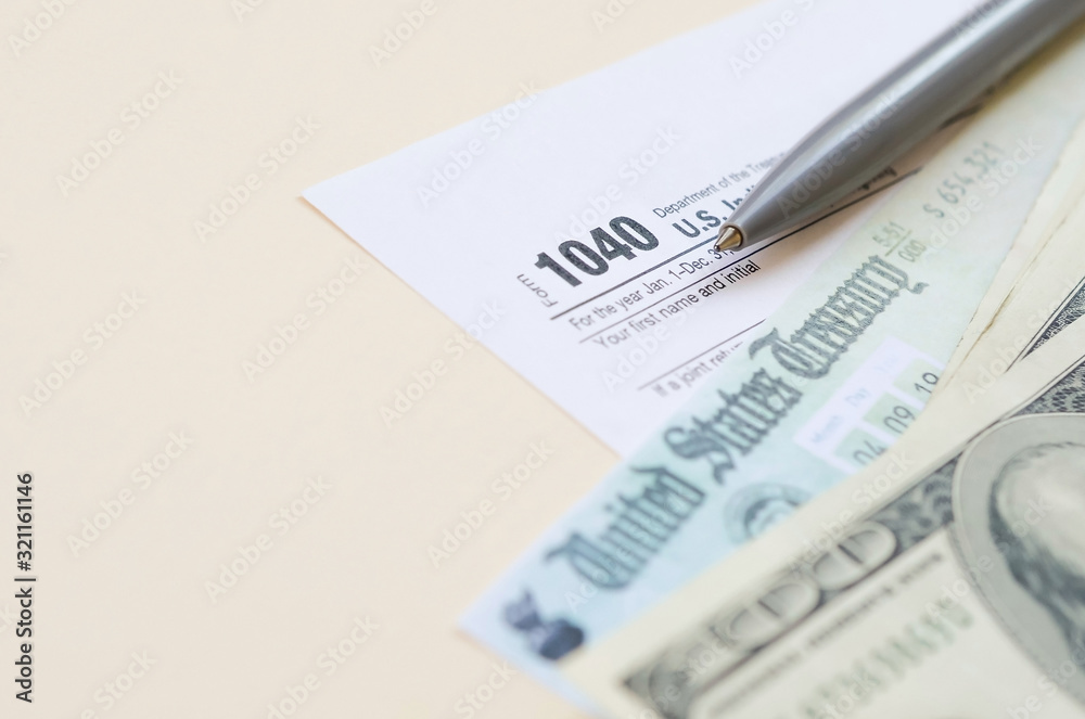 1040 Individual Income tax return form with Refund Check and hundred ...