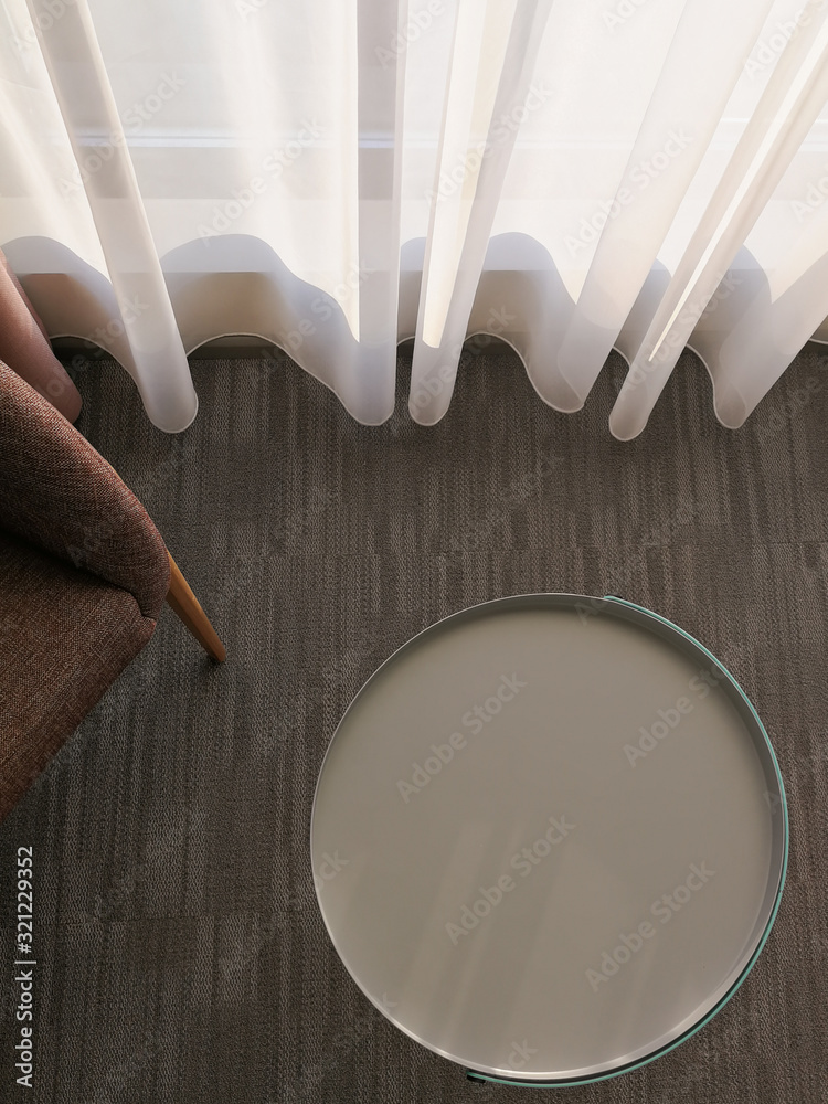 Round end table mockup in a hotel interior. Empty metal coffee table ...