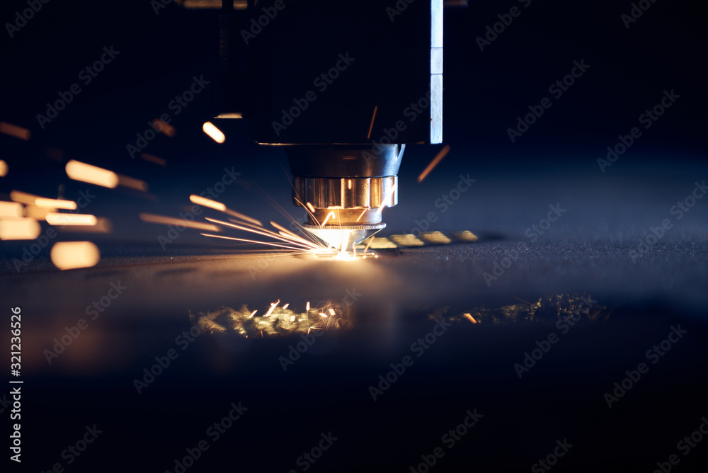 CNC Laser cutting of metal close up, modern industrial technology ...