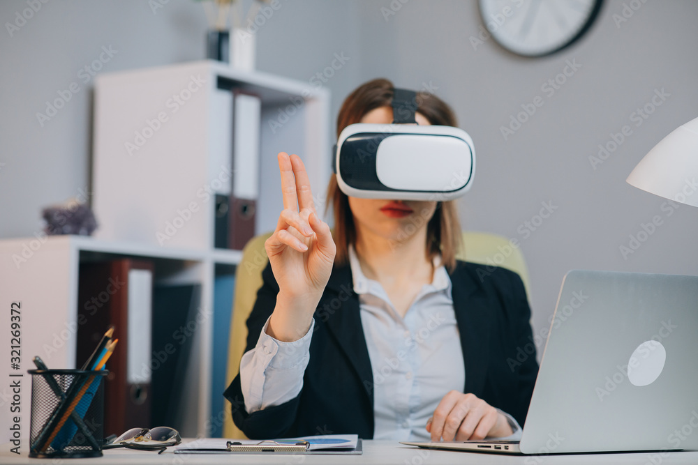 Caucasian female professional woman using augmented reality AR hololens ...