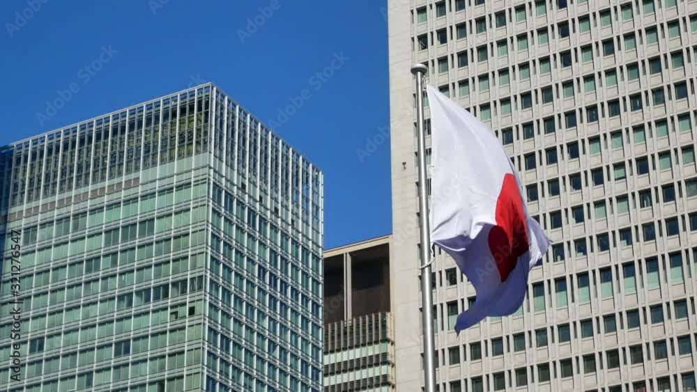 Japan flag with background of modern high-rise building in Tokyo,Japan ...
