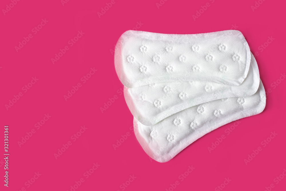 women intimate hygiene products - sanitary pads and tampon on pink ...