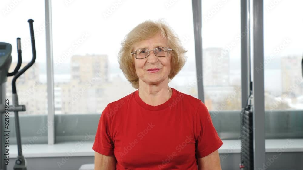 Sport Importance in life. Senior women with fitness trainer in gym ...