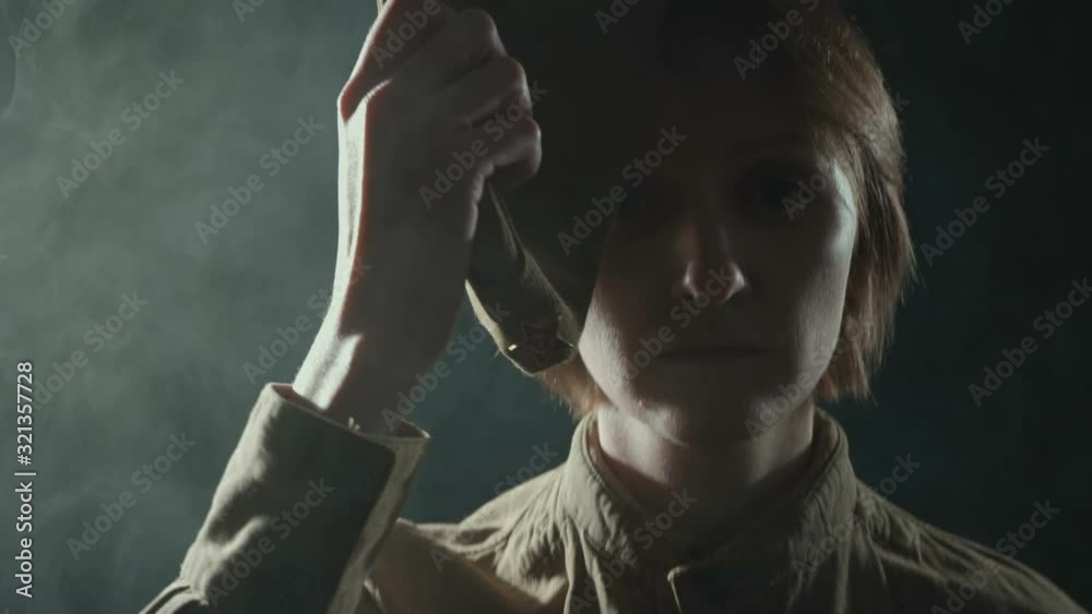 Footage of woman wearing soviet army uniform in shadow Stock-Video ...