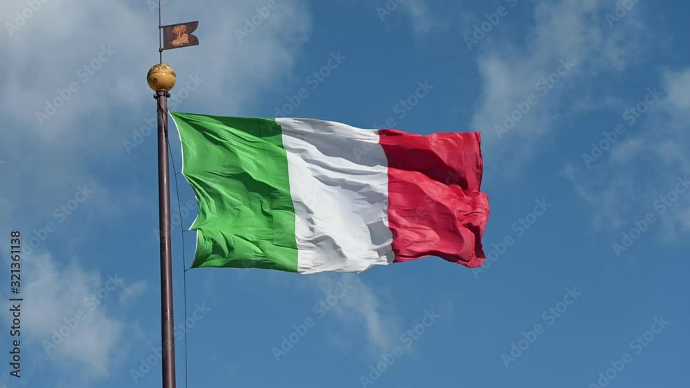 The flag of the Italian Republic flies in the large square of Palmanova ...