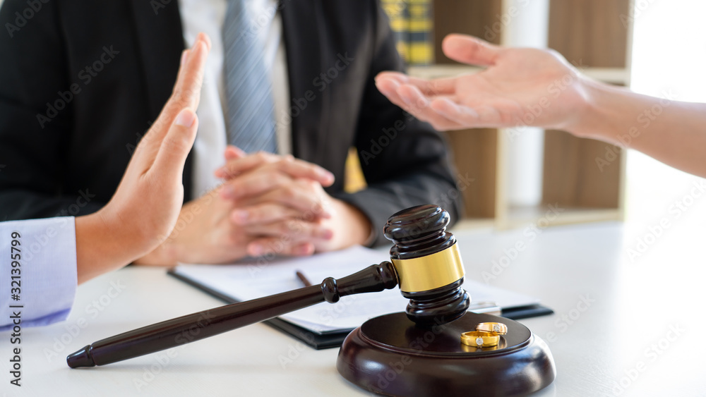 Couple husband and wife during divorce process listening to lawyer ...