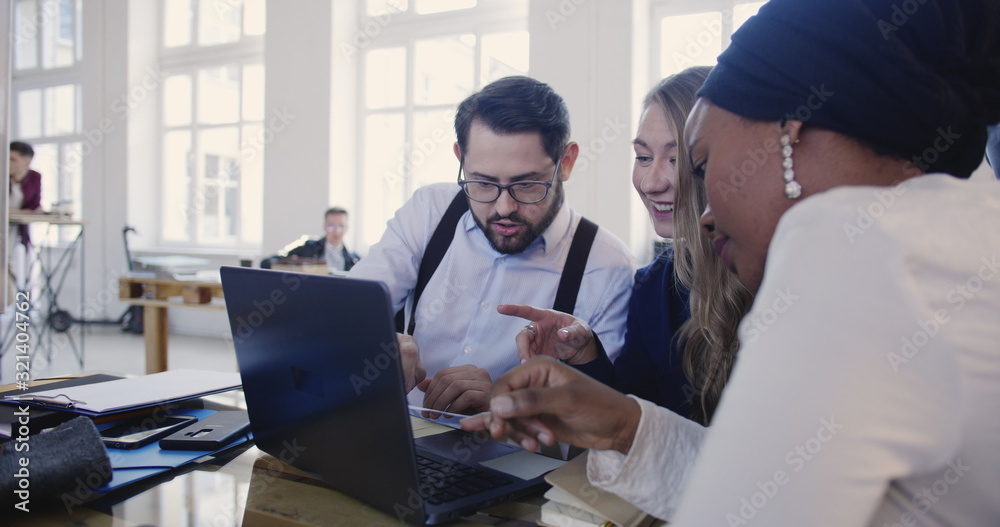 Multiethnic marketing company managers work together with diagrams and ...