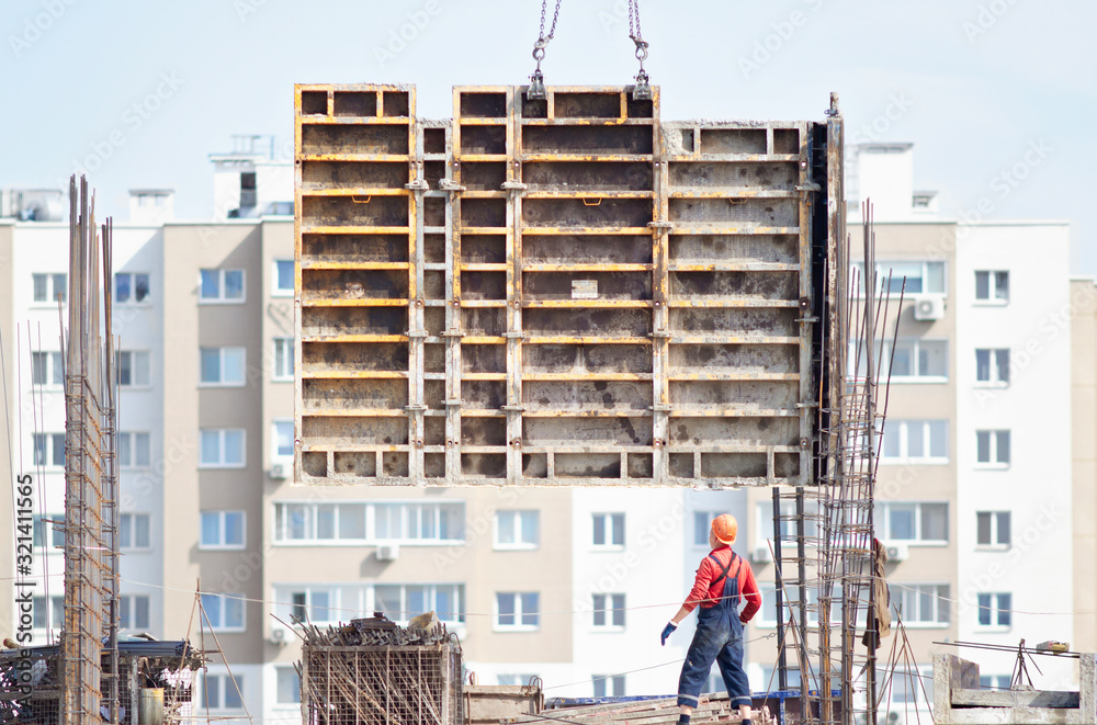 Constraction. Man in helmet building new floor. Working with concrete ...