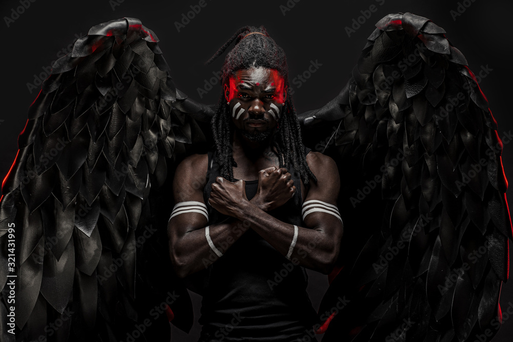 portrait of african man, black serious muscular angel from heaven ...