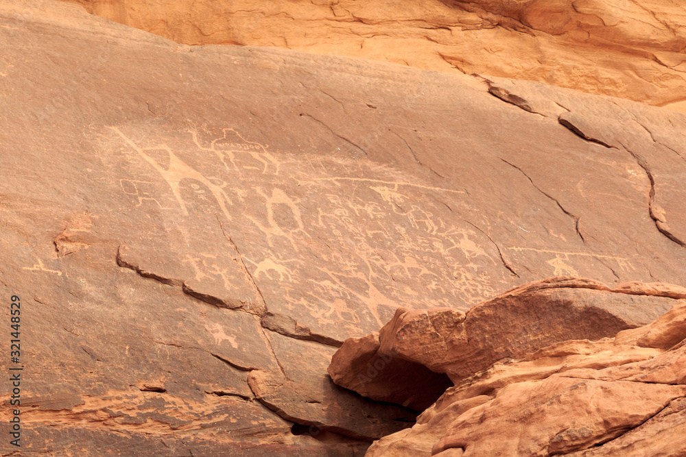 Thamudic and Nabataean petroglyphs and inscriptions on mountain in Wadi ...