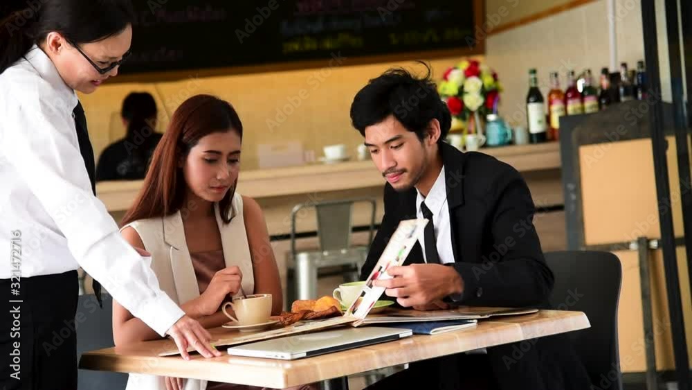 Couple lover order food to waitress in restaurant on 14 feb valentine's ...