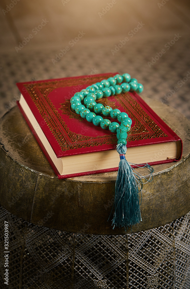 Islamic holy book Koran with rosary beads, muslim faith Allah and ...