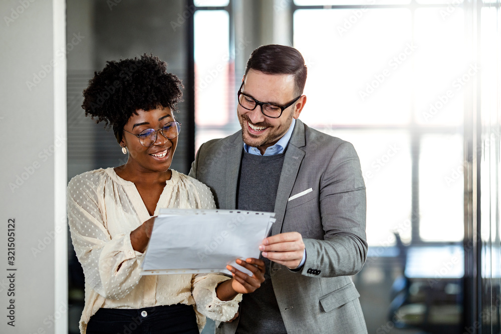 Foto de Shot of two professional coworkers together at work. Couple of ...